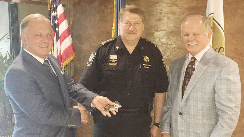 Retired deputy chief Joseph Cardella gifts coins | L'Observateur