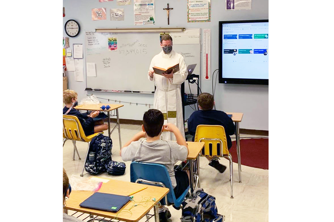 PHOTO FEATURE: Father Ducote blesses classrooms | L'Observateur