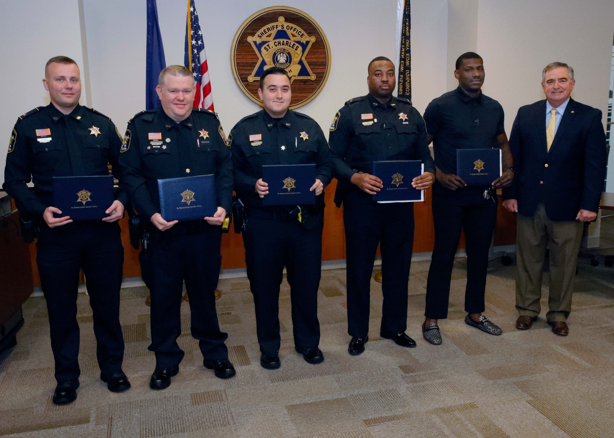 Sheriff Greg Champagne presents several employee awards | L'Observateur